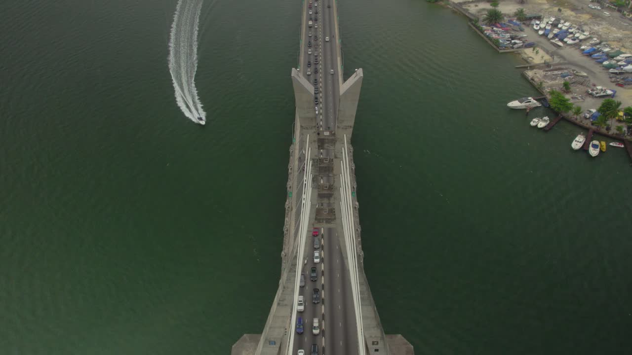 Premium stock video - Ikoyi link bridge aerial view with a speed boat below