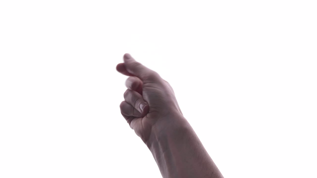 Premium stock video - Close up of hand snapping fingers against white ...