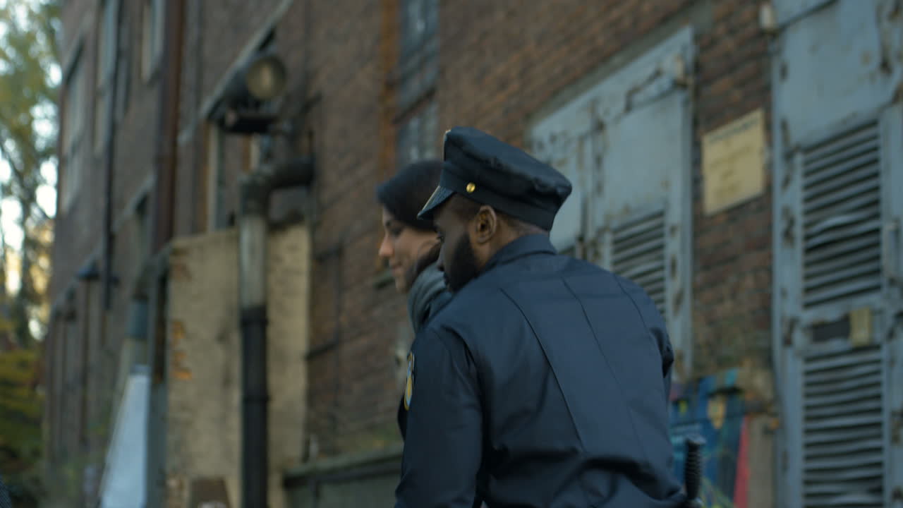 Free stock video - Strong police officer holding and escorting young ...
