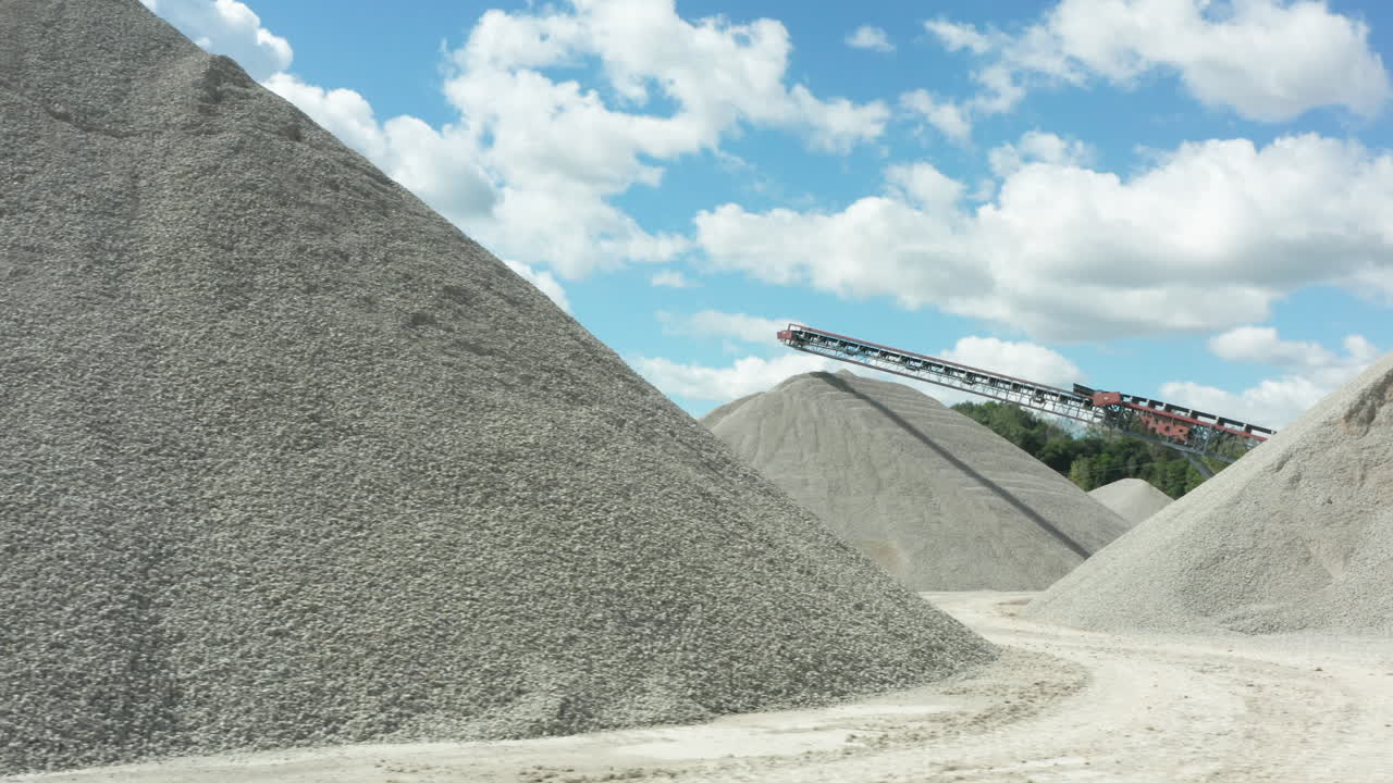 Cinematic Ground Shot Panning Limestone Quarry Revealing Sand Piles And ...