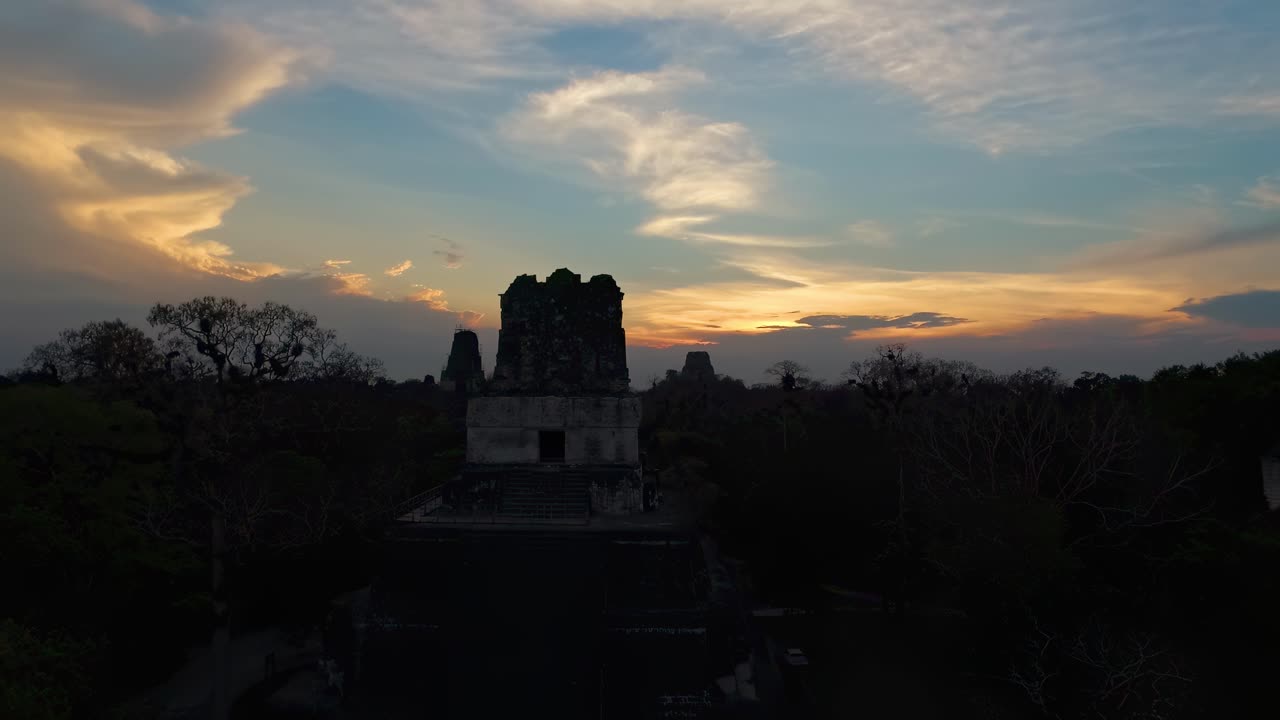 Premium stock video - Sunset over tikal and the ancient maya temples
