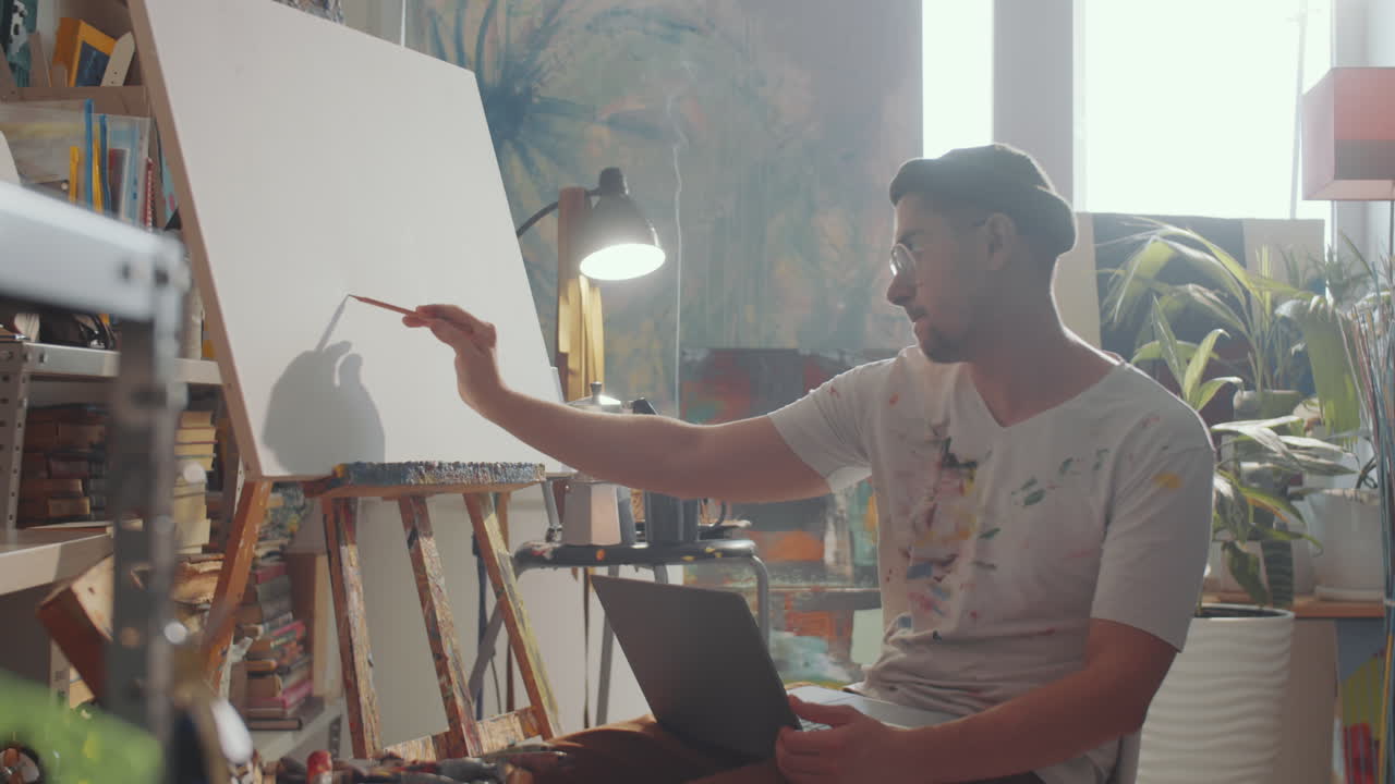 Artist Using Laptop While Drawing Picture In Studio Free Stock Video ...
