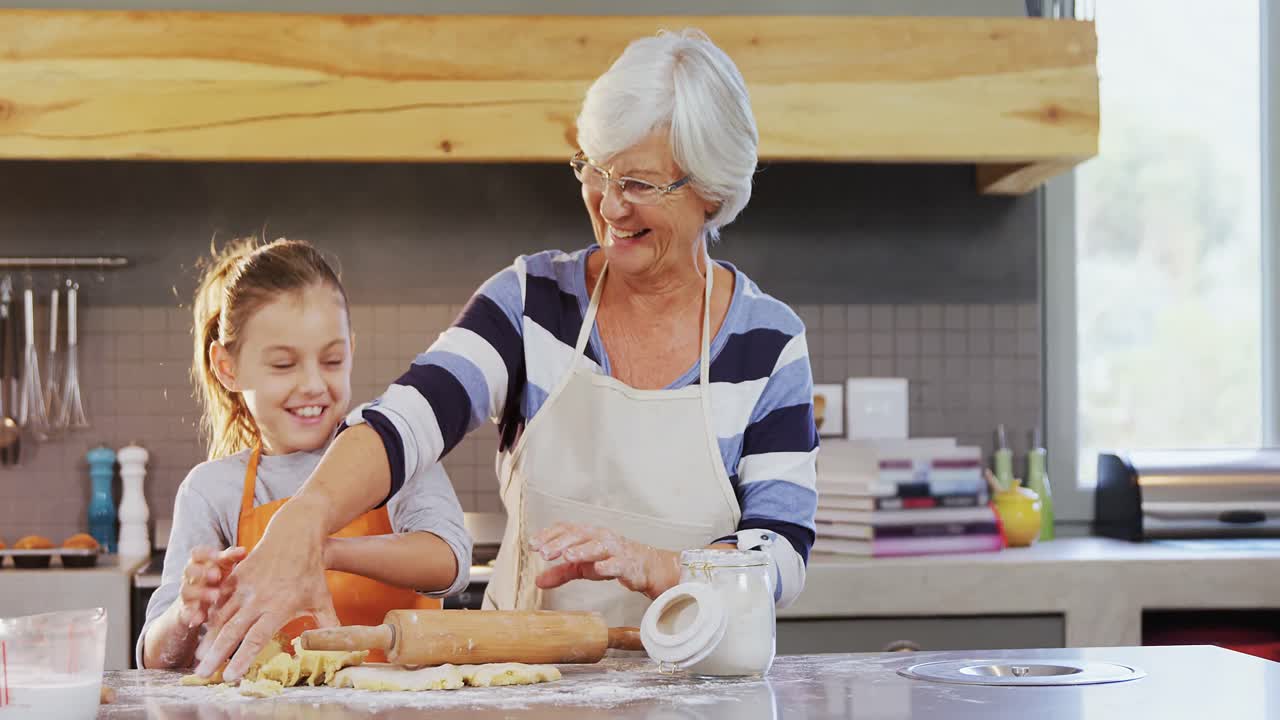 Premium stock video - Happy grandmother and little girl with rolling ...