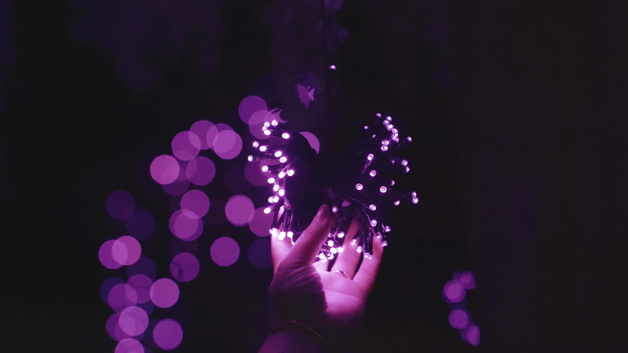 Premium stock video - Purple light ball on hand