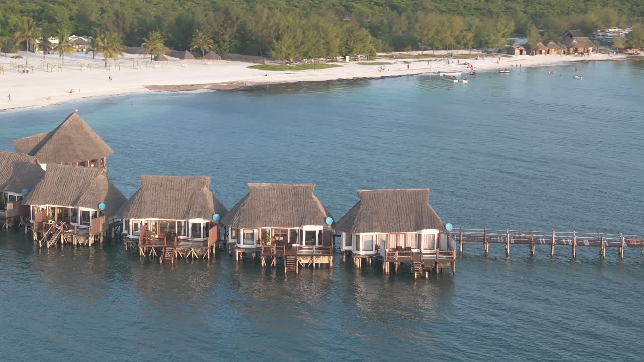 aerial view orbiting luxurious thatched roof kae funk chalets indian ...