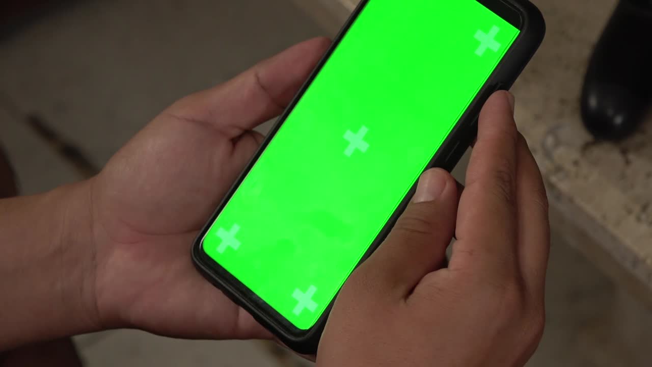 Premium stock video - Hands taping on an smartphone chroma screen
