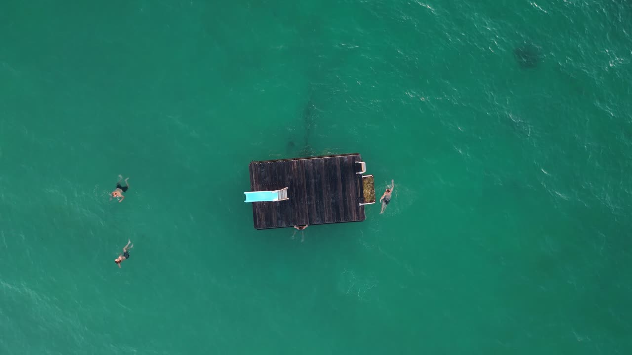 People jumping from floating platform in coogee beach, perth city ...