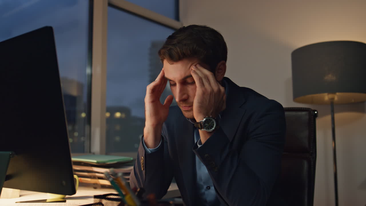 Premium stock video - Stressed employee massaging head closeup ...