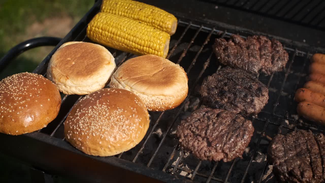 Mixed american barbecue food on hot grill Premium Stock Video Footage