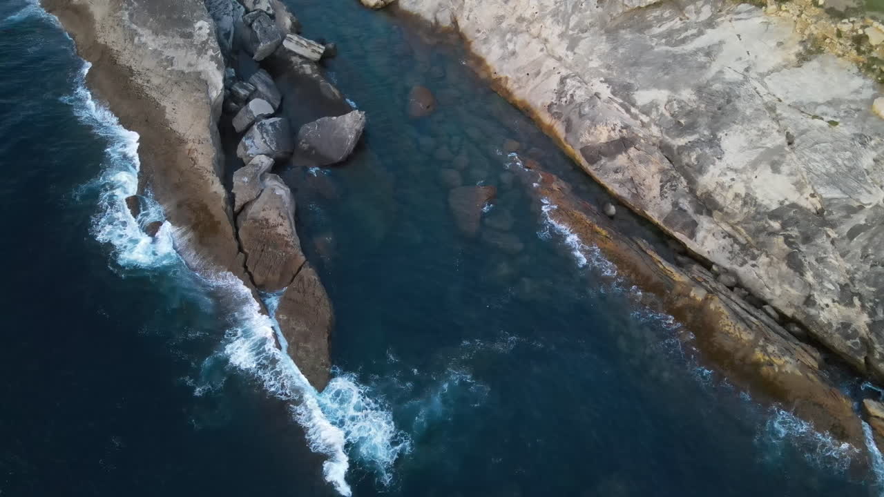 Aerial View Of Sea Waves Splashing On Rocky Shore Free Stock Video ...
