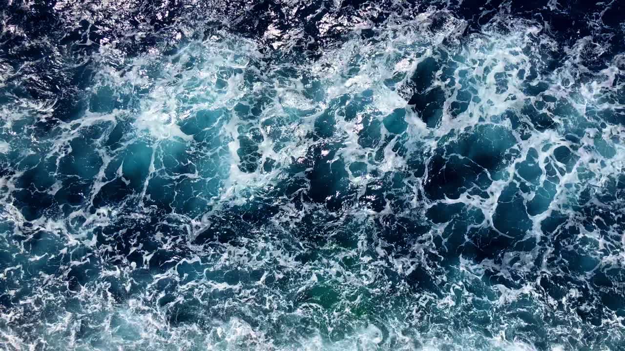 Premium stock video - The ships wake with sun reflecting of the waters ...