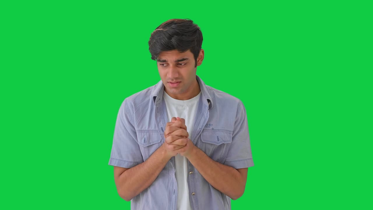 Scared indian boy praying to god green screen Premium Stock Video Footage