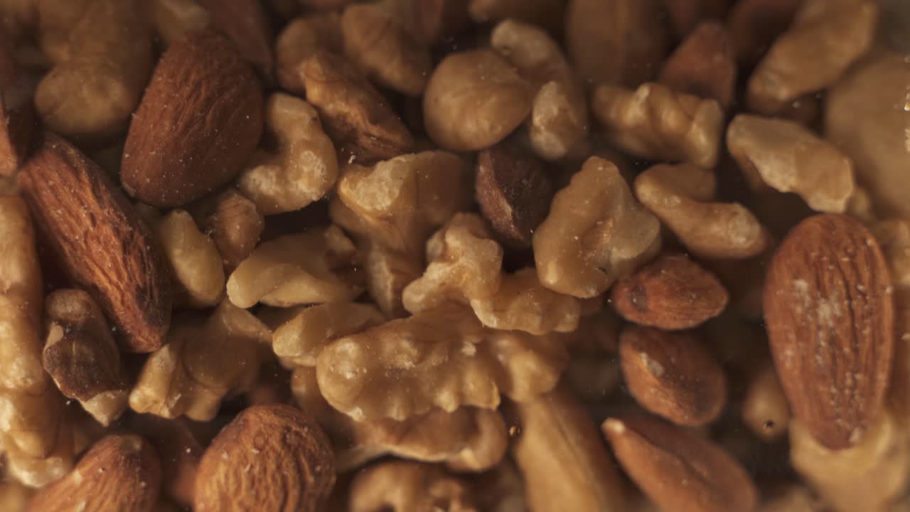 Premium stock video - Close up shot of different varieties of nuts ...