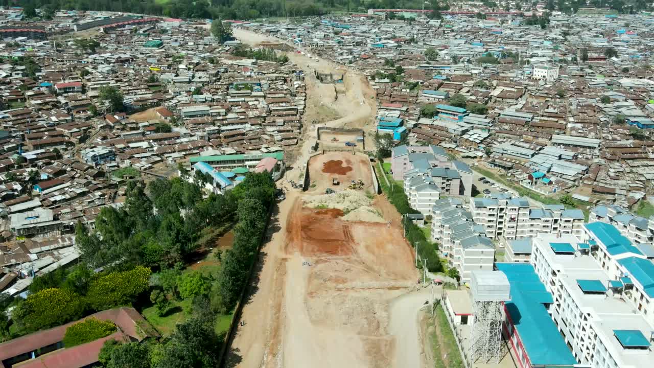 Poor slums district with old rubble stony road and modern capital city ...