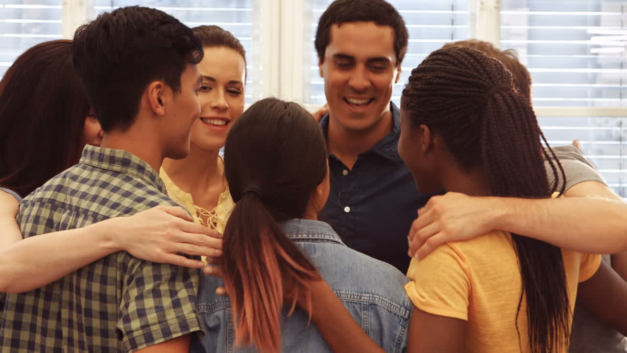 Group of business executives forming huddle | Premium Stock Video Footage