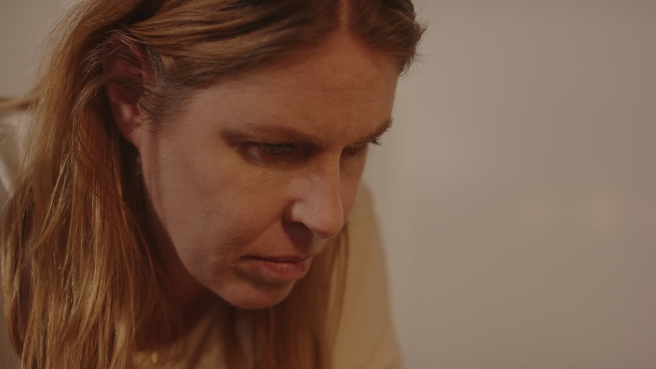 Premium stock video - Close up of woman intensely reading something