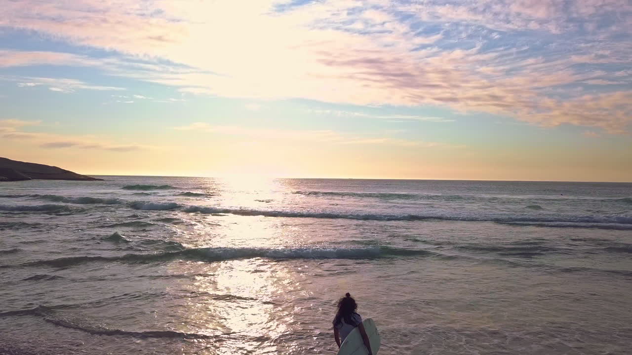 Premium stock video - Find me on a surfboard where sun meets sea