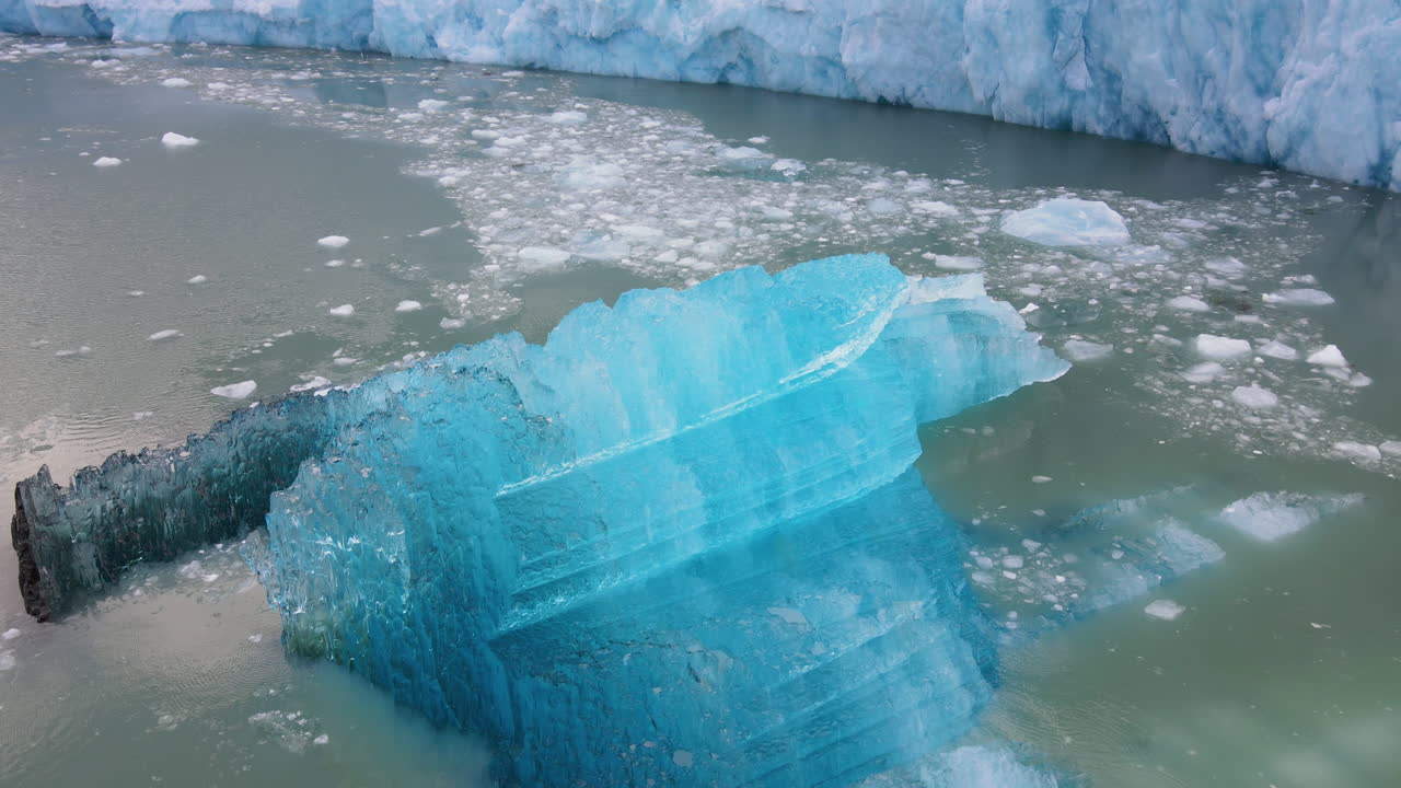 Premium stock video - Drone shot spinning around floating melting ...