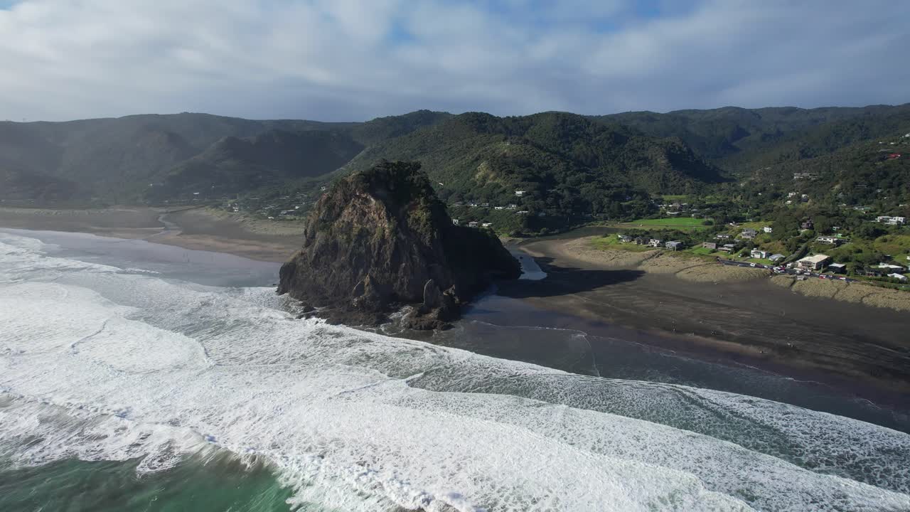 foamy ocean waves at piha beach north island new zealand - aerial drone ...