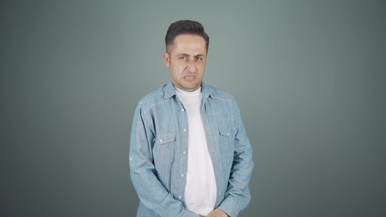Premium stock video - The man is disgusted.