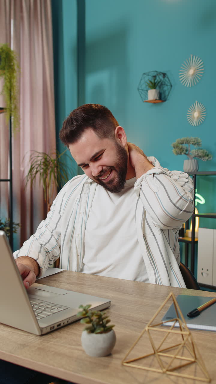 Business man freelancer overworking suffers from spine neck muscle pain ...