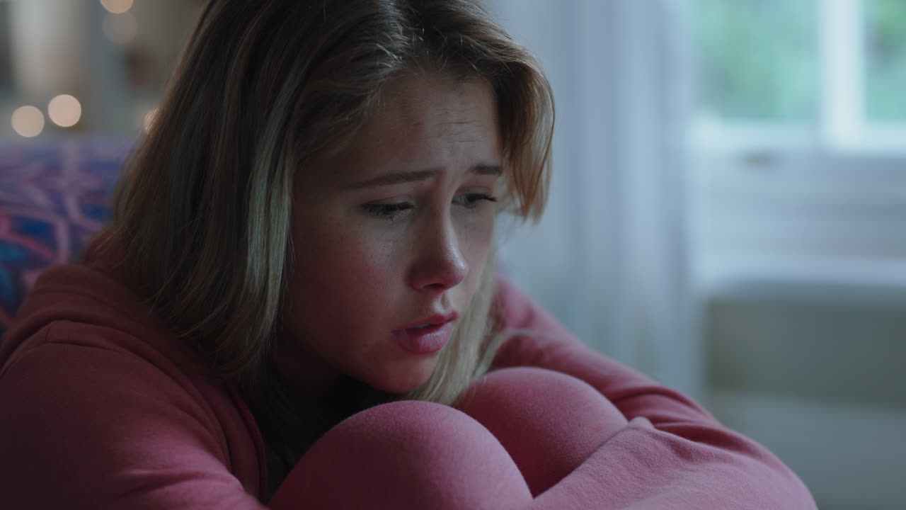 Premium stock video - Sad teenage girl crying at home feeling alone ...