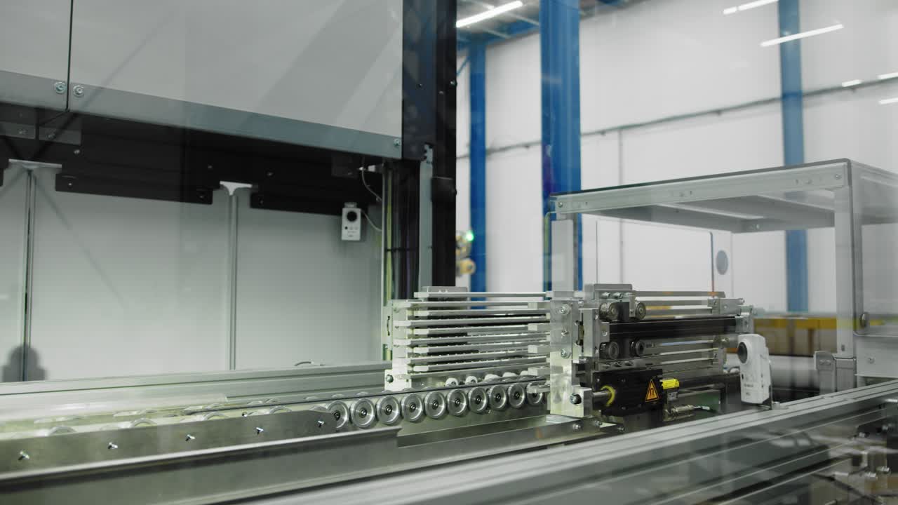 Goods Being Boxed By Automated Machinery; Innovative Engineering Free ...