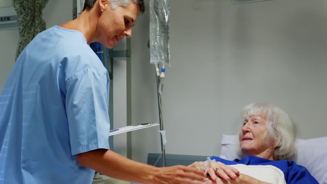 Premium stock video - Female nurse adjusting iv drip 4k