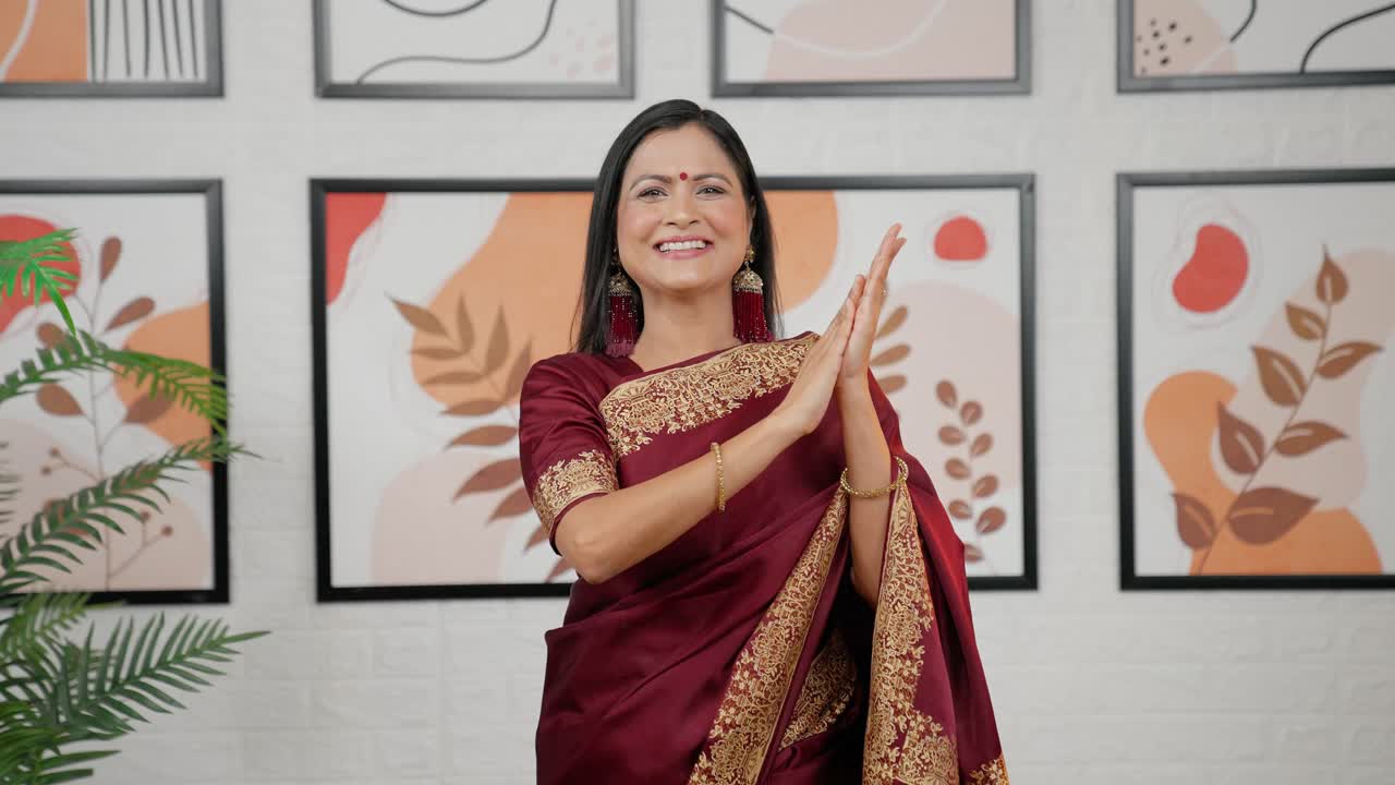 Premium stock video - Indian woman clapping and appreciating