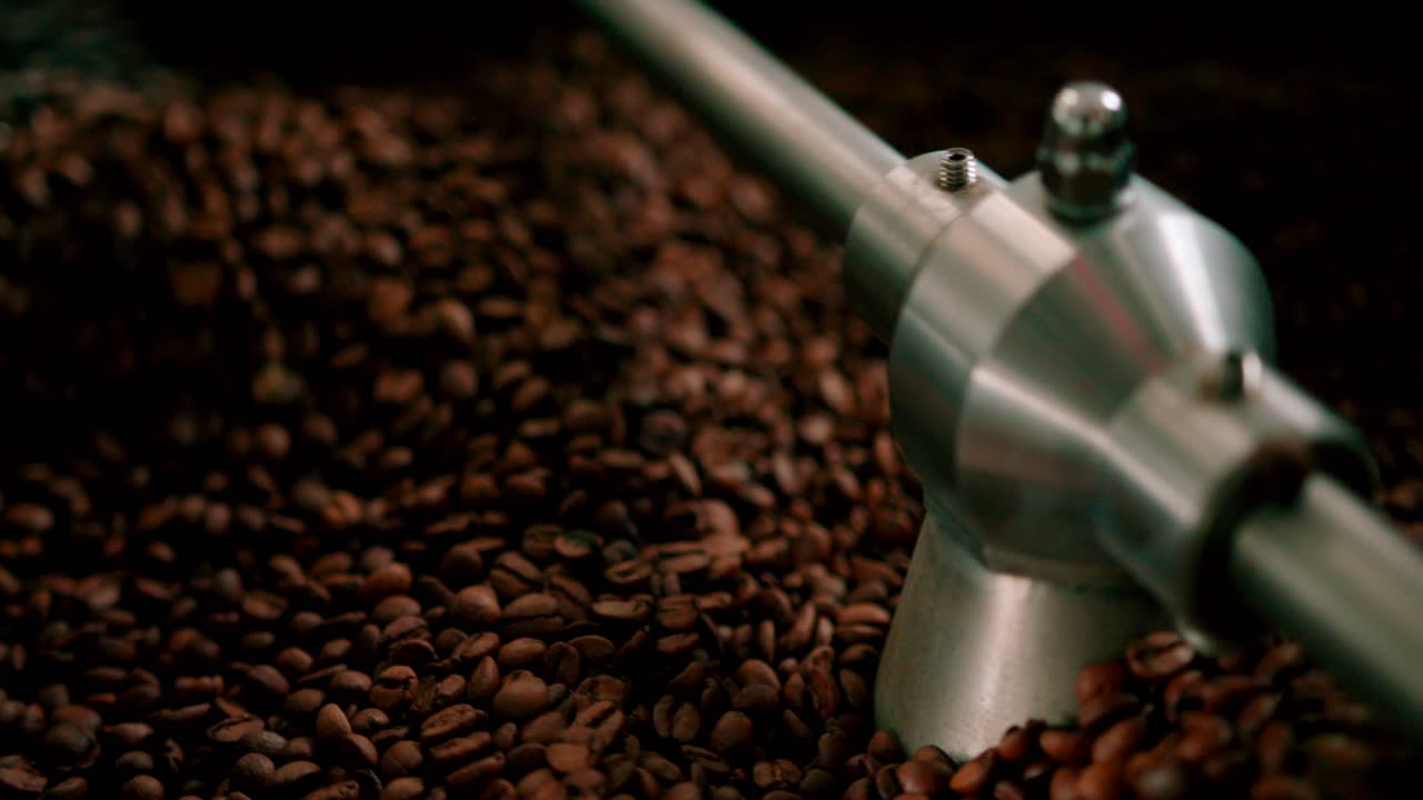 Premium stock video - Close Up To Coffee Roasting Machine In Slowmotion