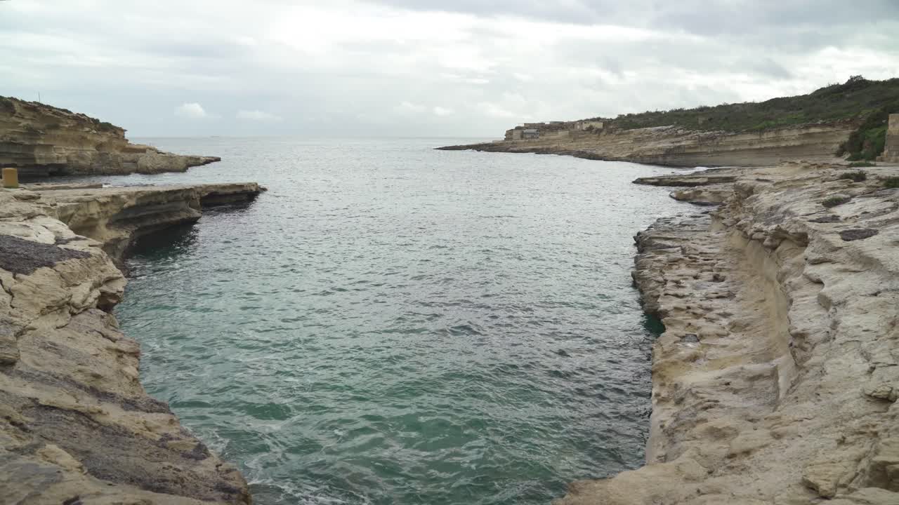 Il-Kalanka Beach In Malta With Calm Mediterranean Sea On Cloudy Day In ...