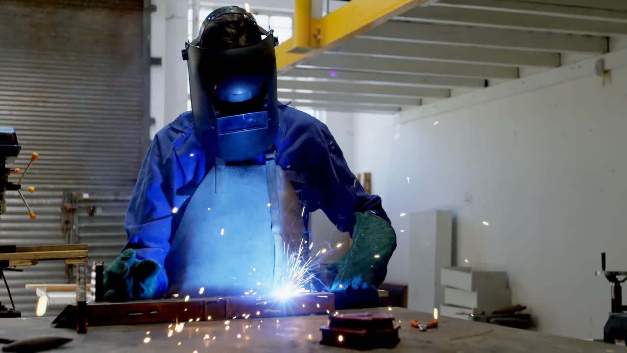 Female welder using blow torch on a rod 4k | Premium Stock Video Footage