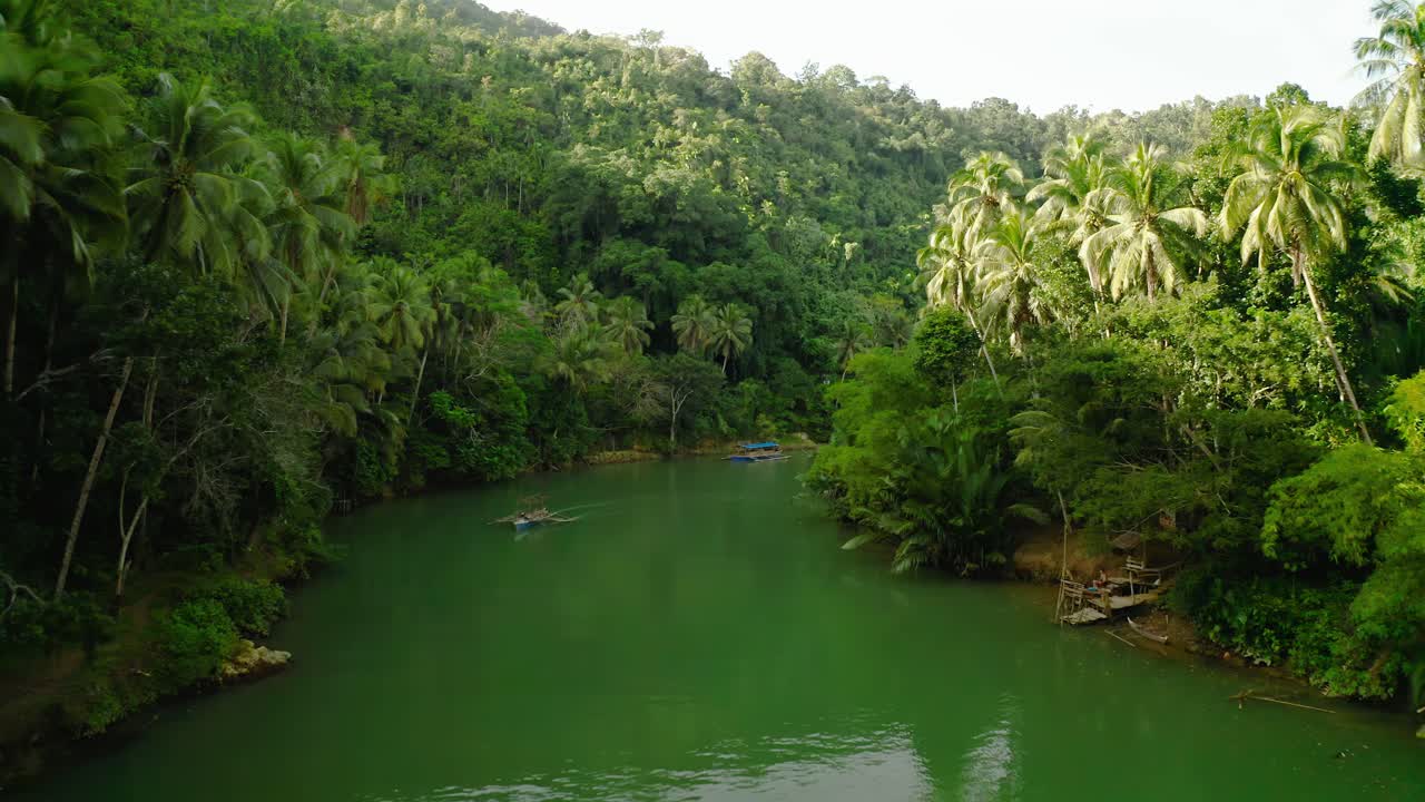 Calm Loboc river in Bohol province where traditional filipino boats ...