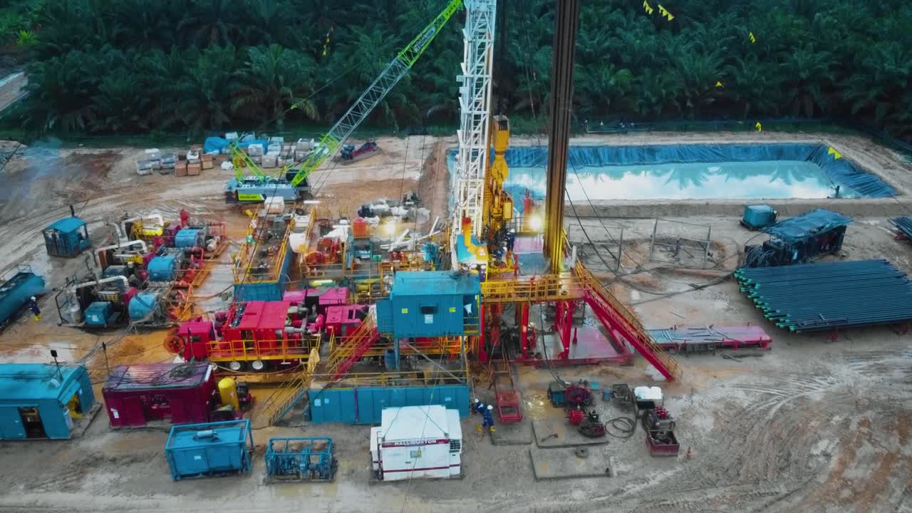 Premium stock video - Cinematic drone shot of onshore drilling and ...