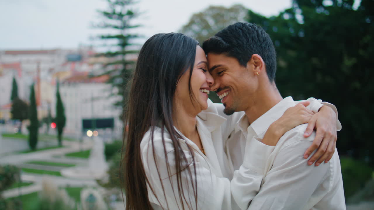 Vertically closeup romantic pair cuddling street. happy woman kissing ...
