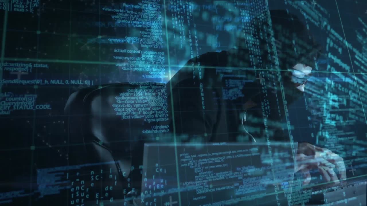 Male Hacker Using Computer To Hack The System And Coding On The ...