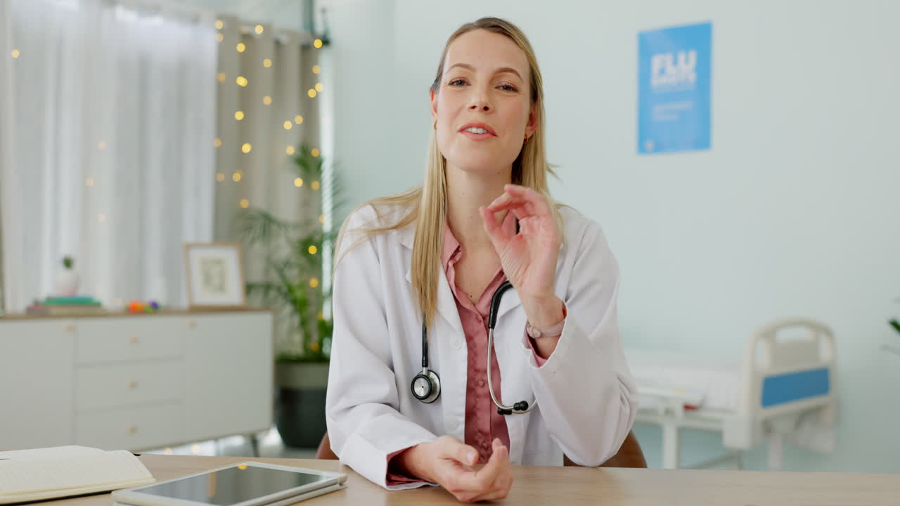 Premium stock video - Doctor, wave and video call in office