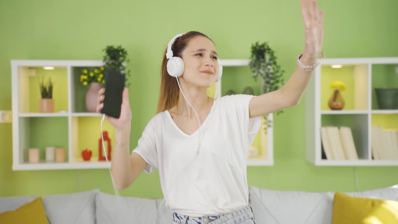 Premium stock video - Happy young woman dancing peaceful and pleasant.