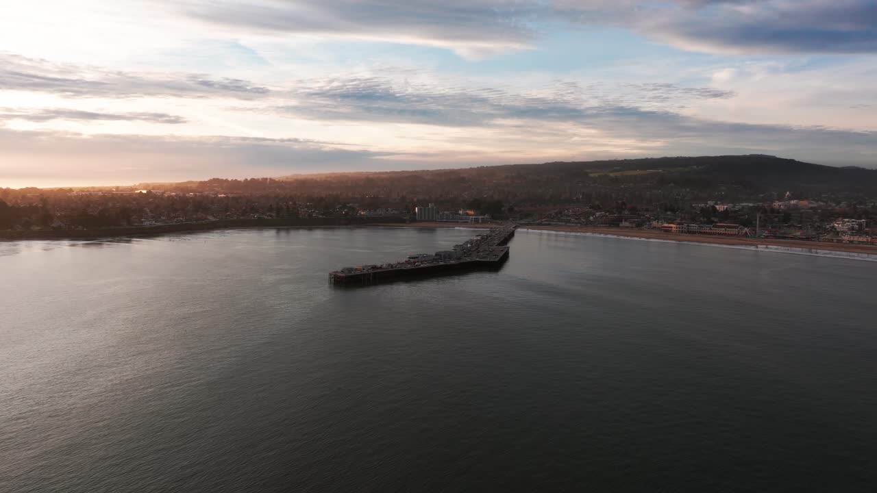 High elevation drone aerial view of santa cruz pier and beach during ...