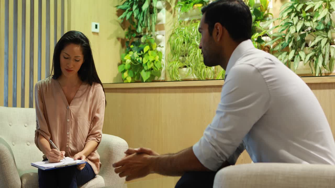 Recruiter taking interview of male candidate Premium Stock Video Footage