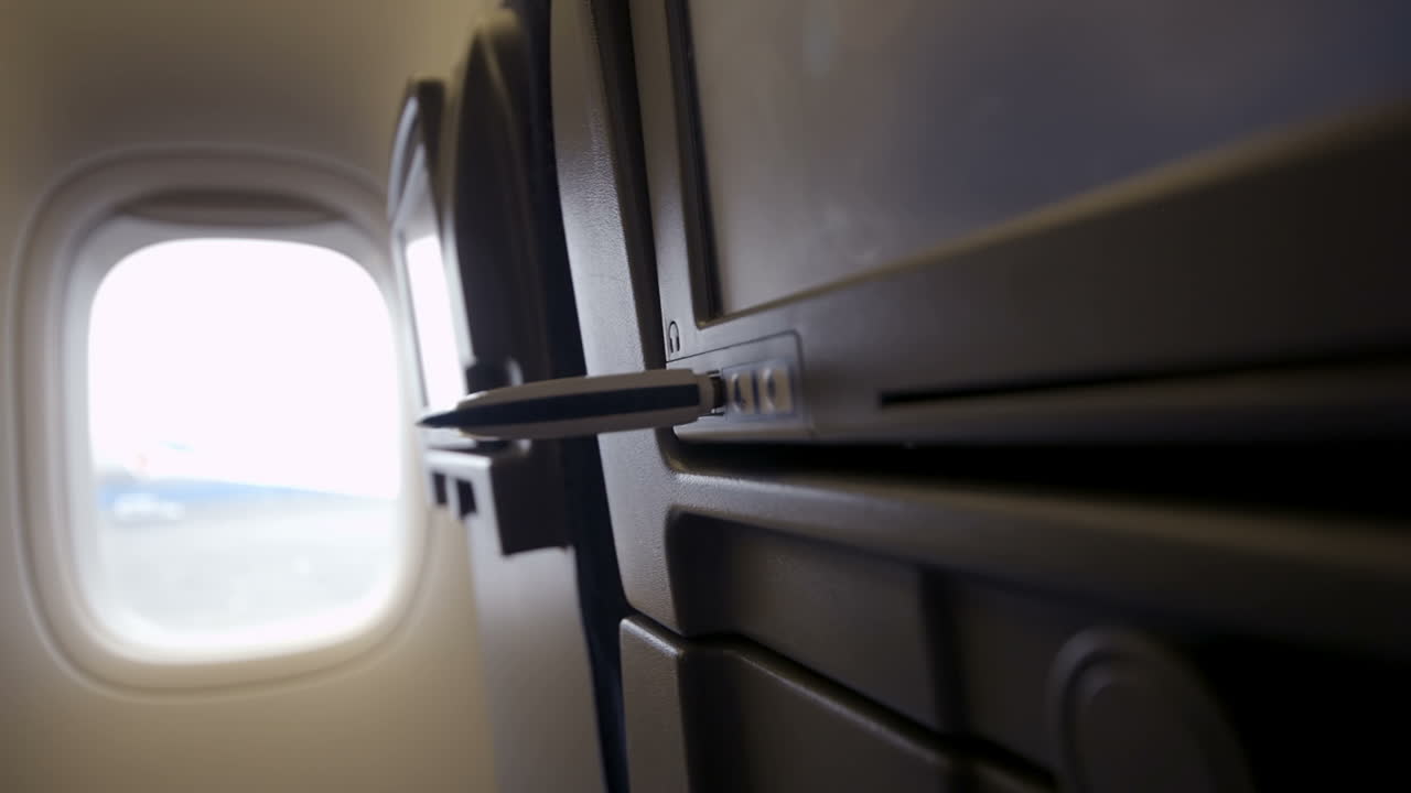 Premium stock video - Inserting usb flash drive into socket of monitor ...