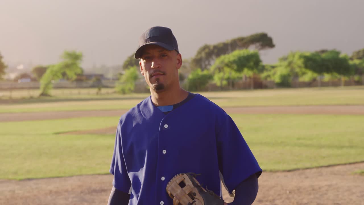 Baseball player looking at camera Premium Stock Video Footage