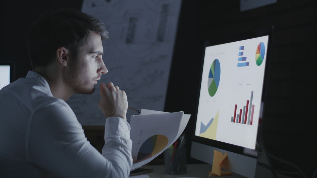 Premium Stock Video Concentrated Business Man Analyzing Financial