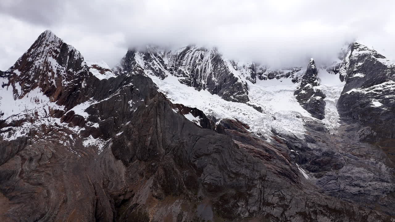 Cinematic aerial view of snowy andes mountains in peru with glaciers ...