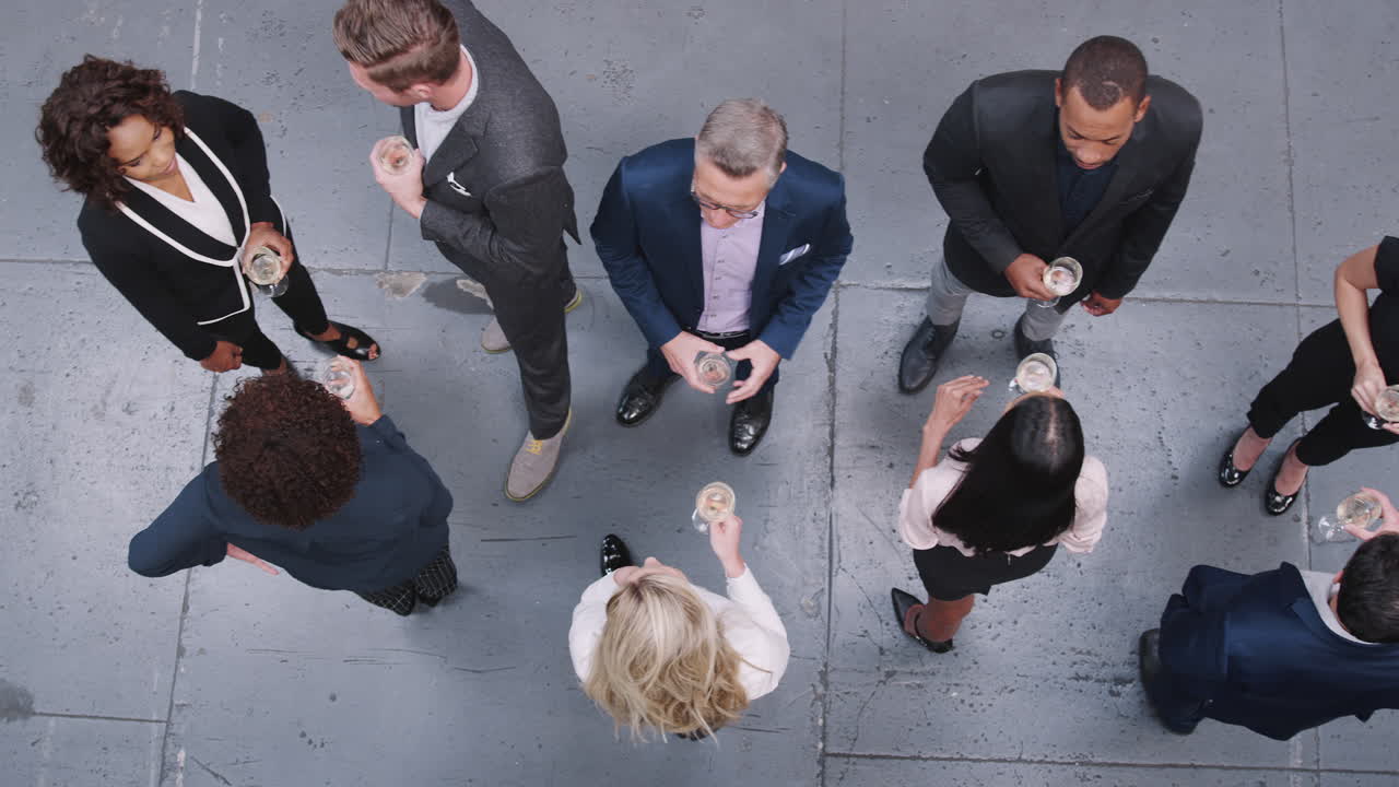 Premium stock video - Overhead shot of business team socializing with ...