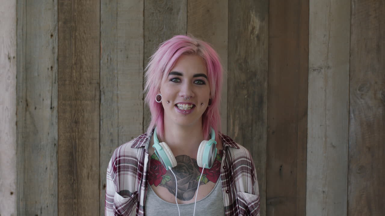 Young punk girl portrait of pretty woman with pink hairstyle smiling ...