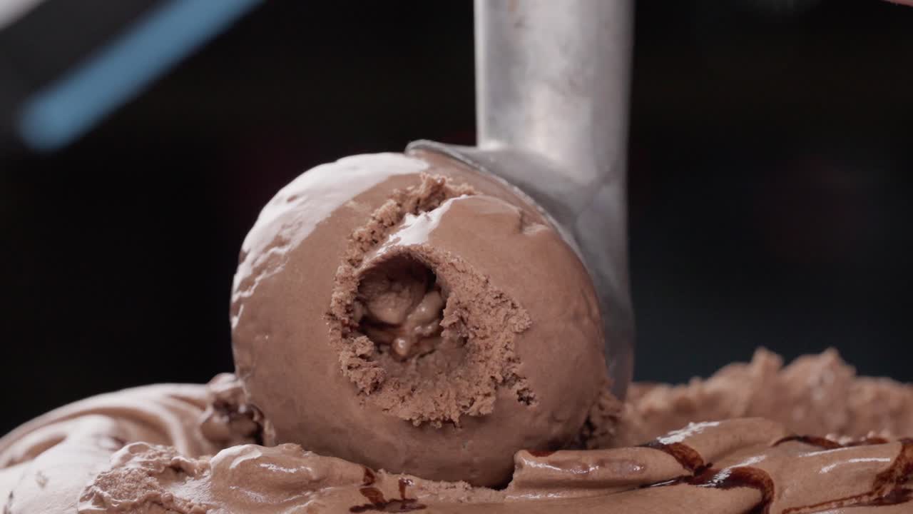 Scoping chocolate ice cream side view Premium Stock Video Footage