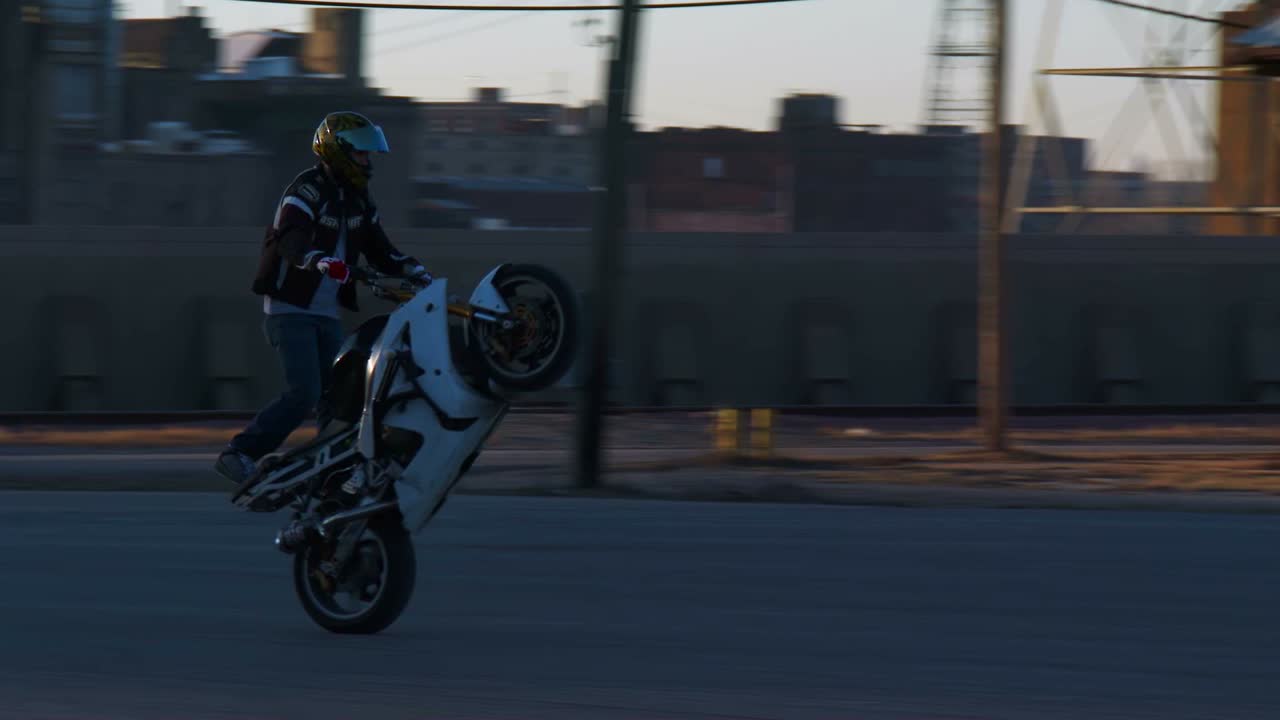Premium stock video - A rider performs amazing stunts on a motorcycle ...