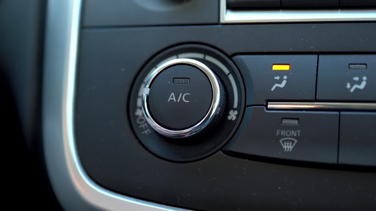 Premium stock video - Turning off air conditioner of a car