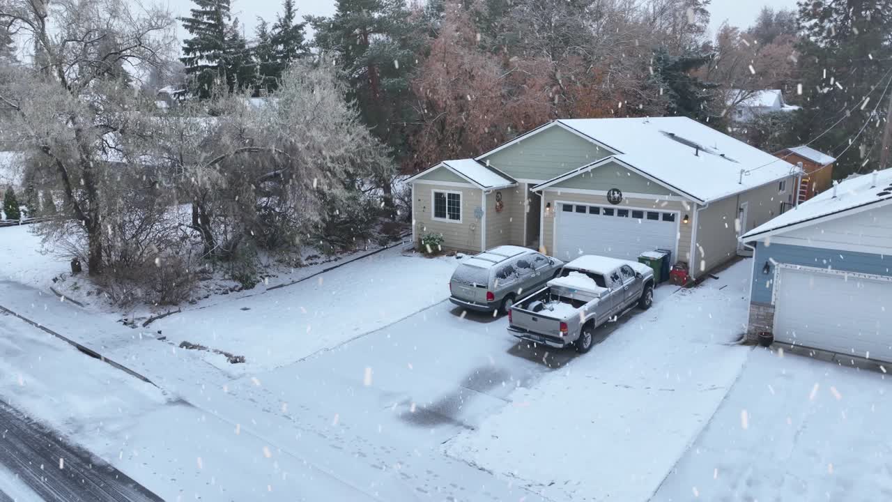 Premium stock video - Exterior aerial view of a snowed in home during a ...